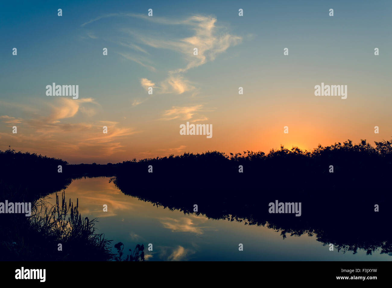 sunset on the river Stock Photo - Alamy