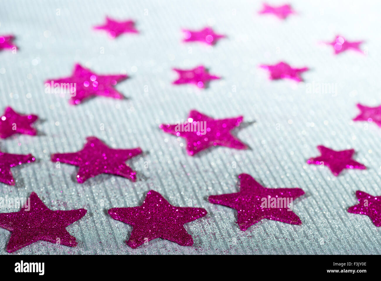 Christmas background with a lot of violet stars Stock Photo - Alamy
