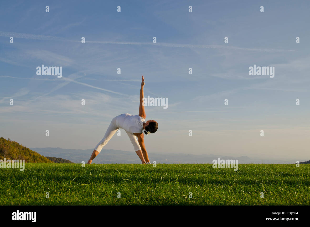 Twisted triangle pose hi-res stock photography and images - Alamy