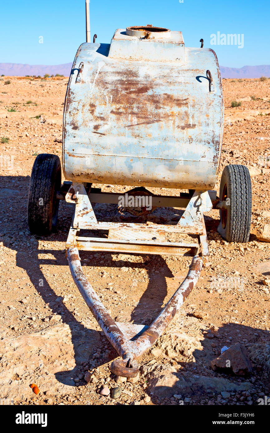 water tank in morocco africa land gray metal weel and arid Stock Photo ...