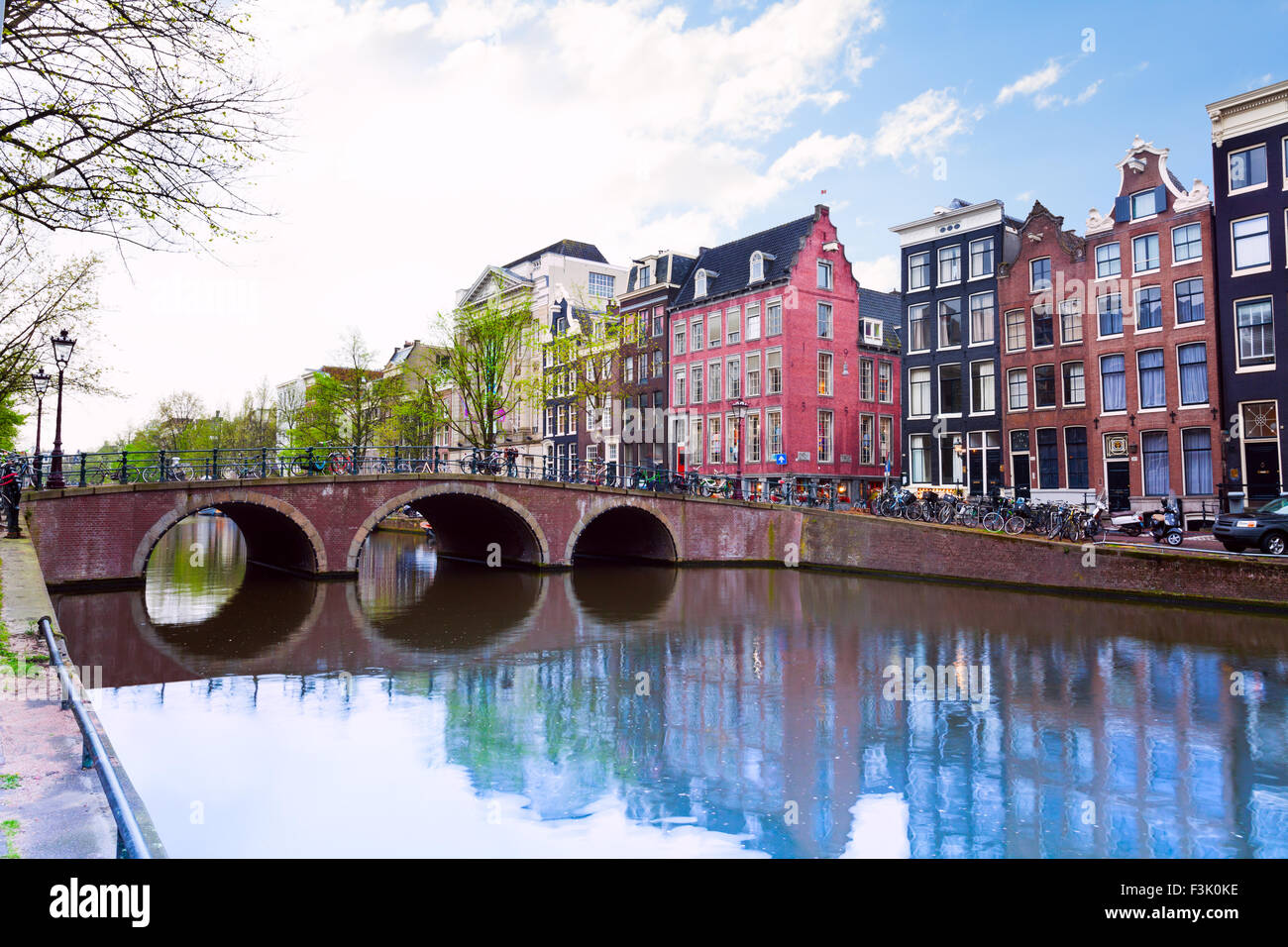 Amsterdam canal view with river and houses Stock Photo - Alamy