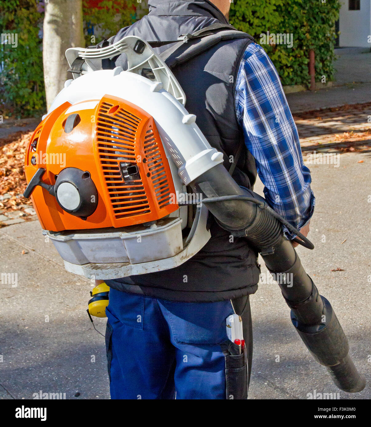 Man with leaf blower Stock Photo - Alamy