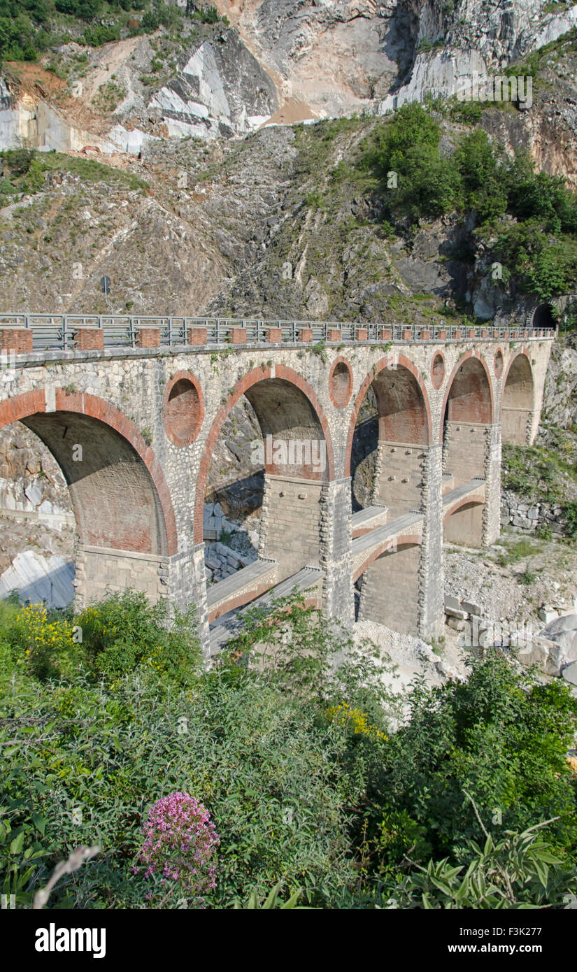 View of old bridge of quarry marble in Italy Stock Photo - Alamy