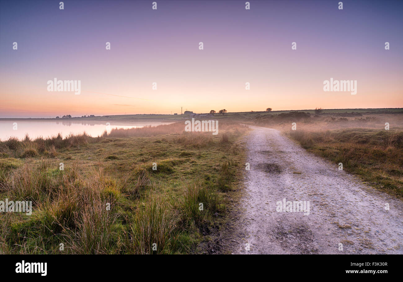 Evening mist rolling in across moorland at Dozmary Pool a remote spot ...