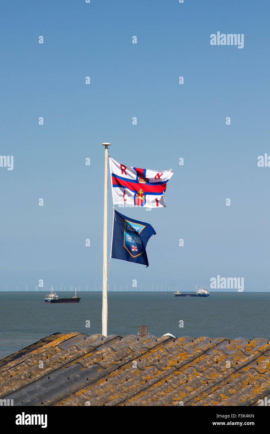 MARGATE, KENT, UK - AUGUST 8. 2015. Lifeboat flag flying, with wind ...