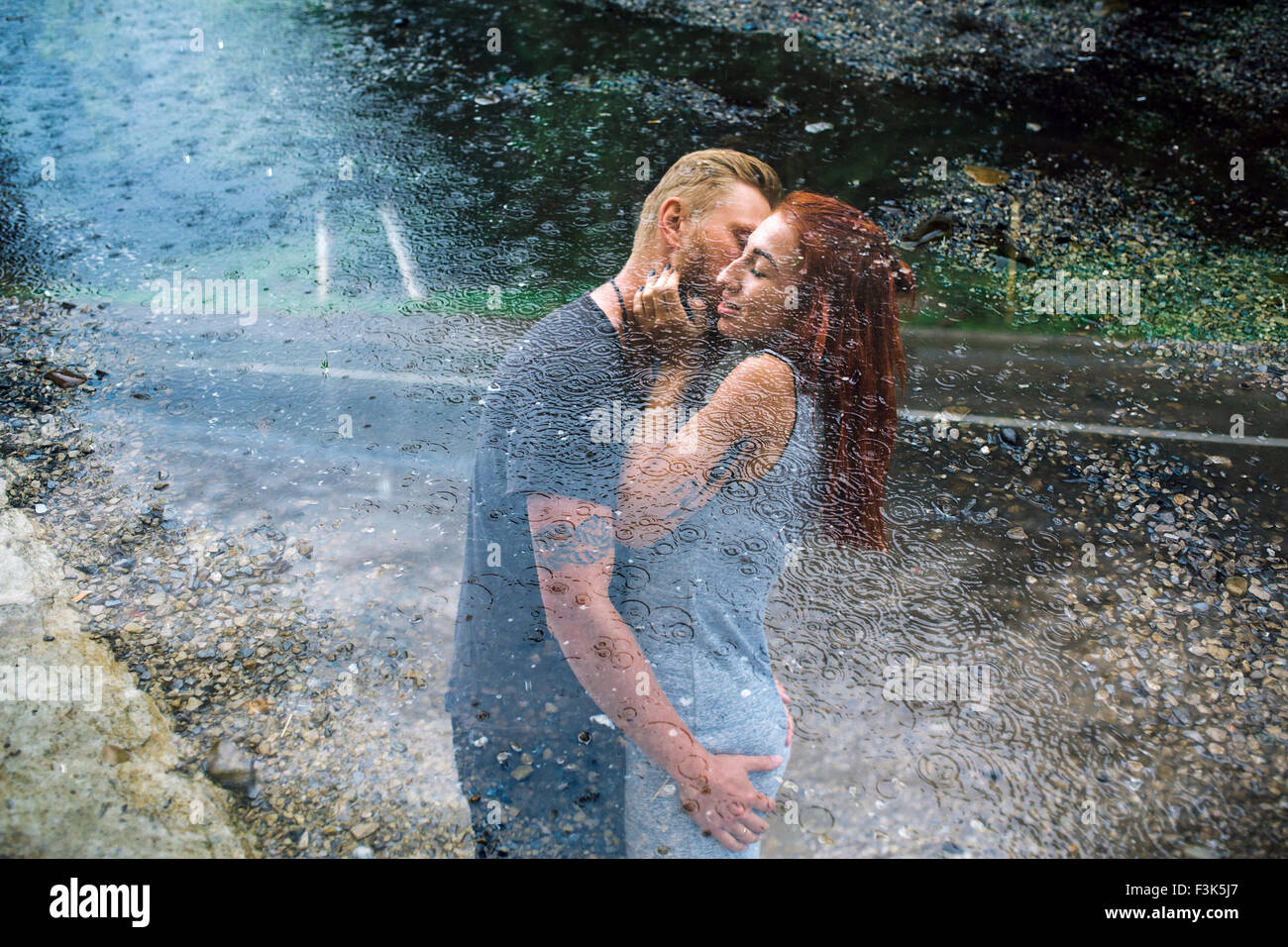 beautiful couple hugging in the rain Stock Photo - Alamy
