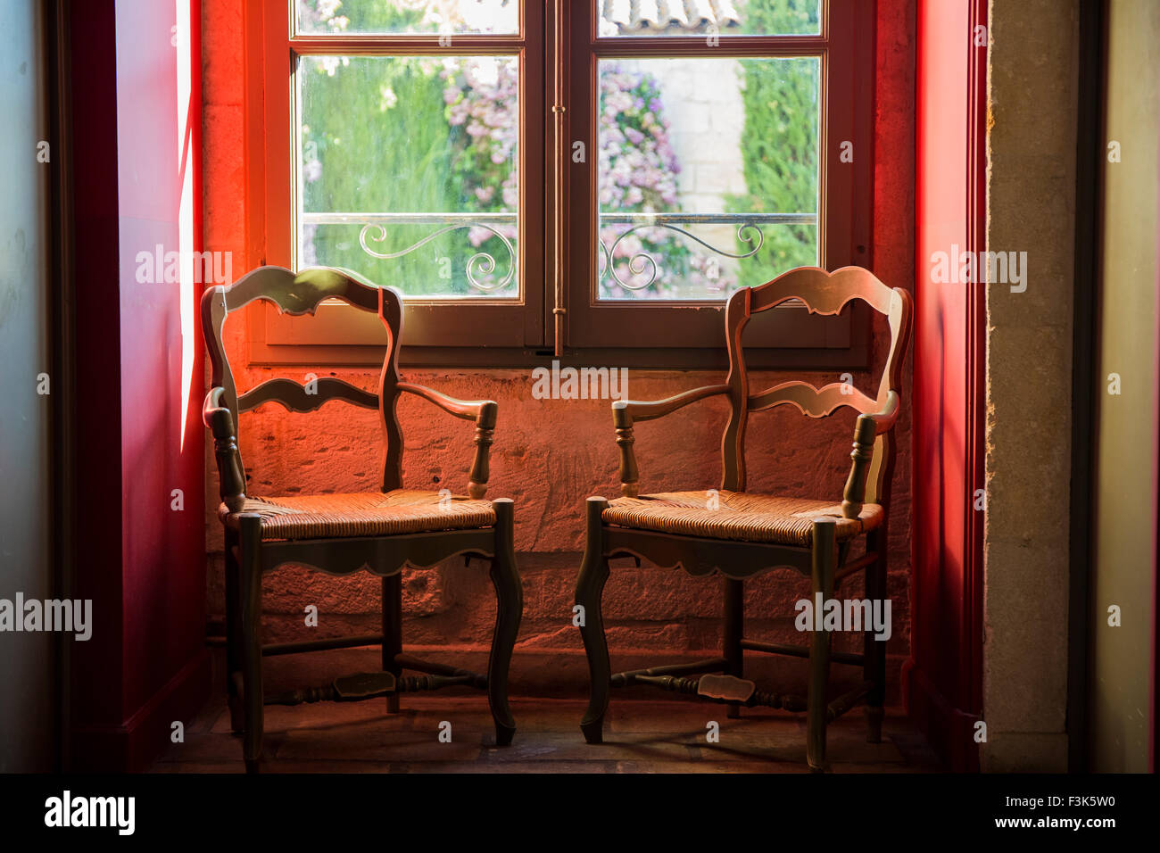 Chairs and window Stock Photo - Alamy
