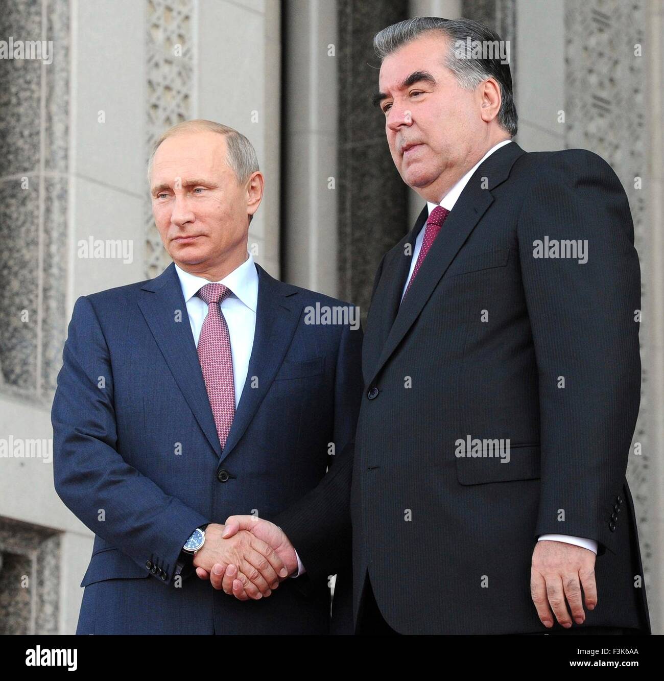 Russian President Vladimir Putin shakes hands with Tajik President ...