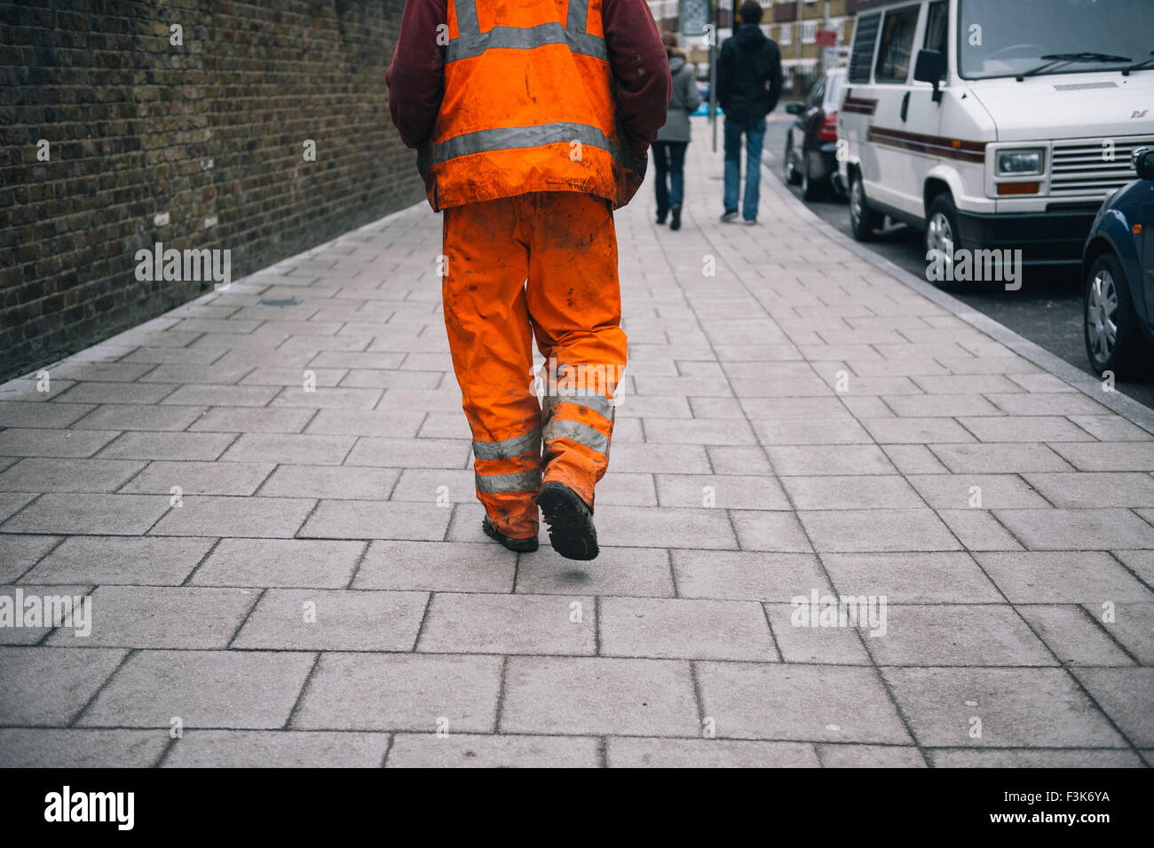 Construction worker walking in Central London Stock Photo - Alamy