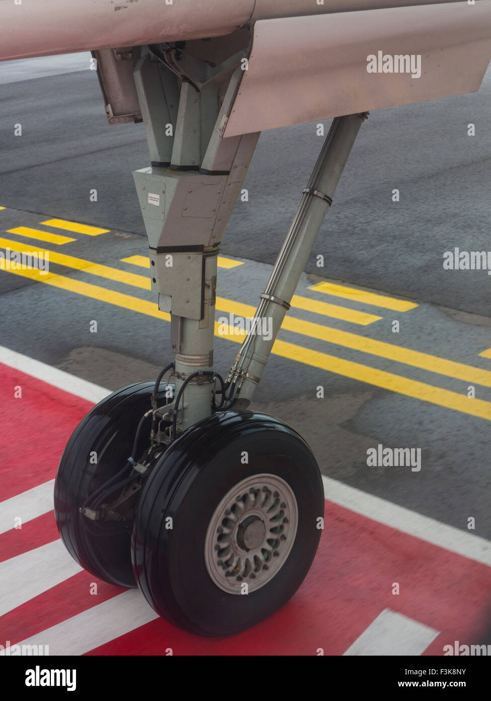 The blurred wheel of an aircraft at takeoff on the airport runway Stock ...