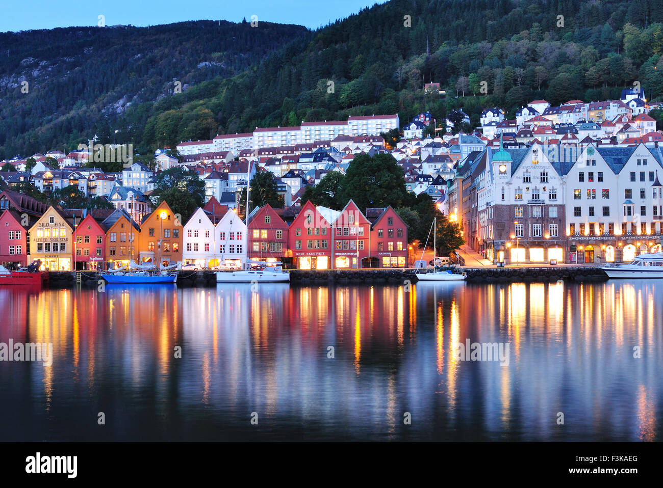 Colorful wooden house of Bryggen Hanseatic Wharf at night, a UNESCO ...
