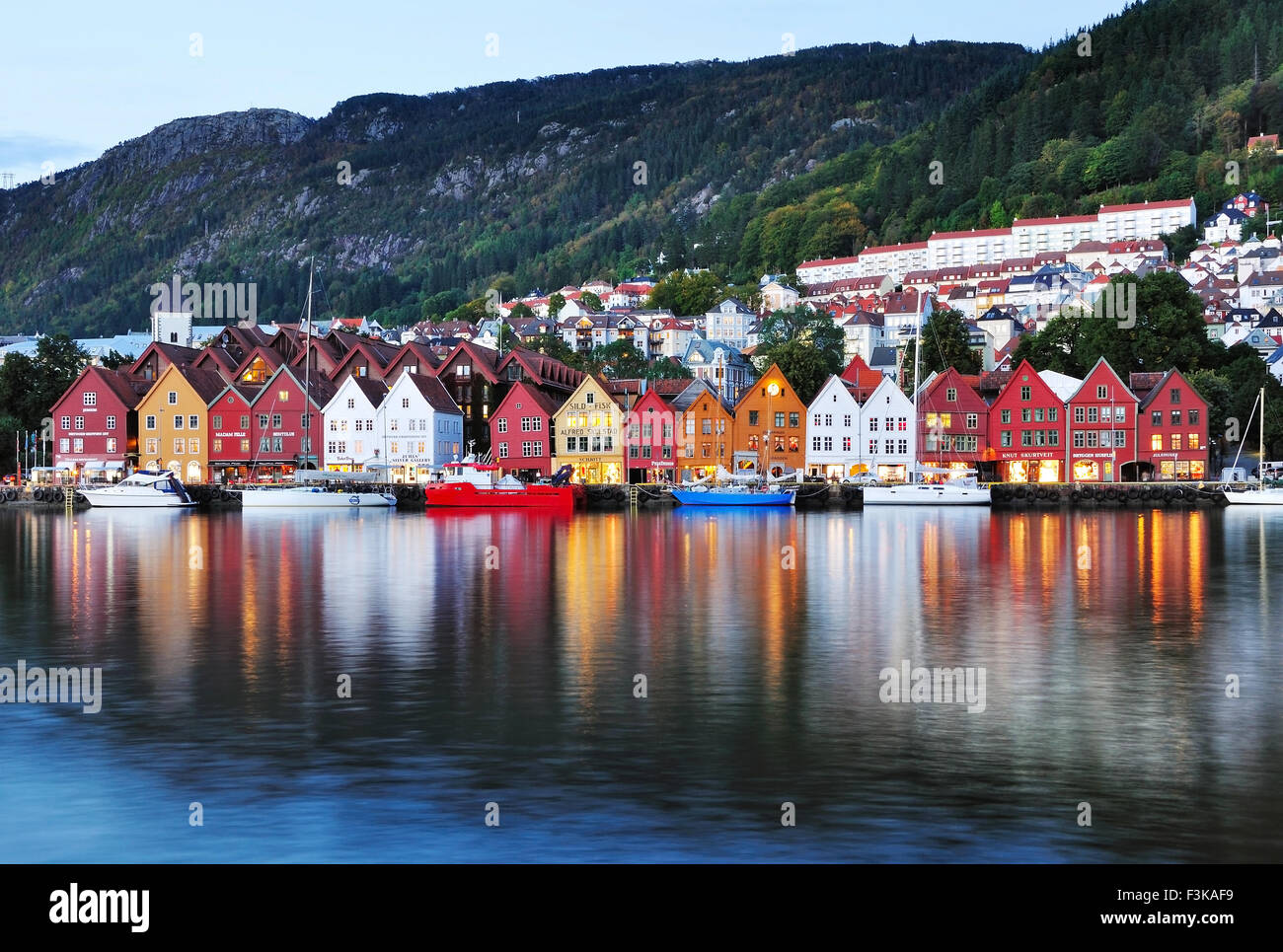 Colorful wooden house of Bryggen Hanseatic Wharf at night, a UNESCO ...