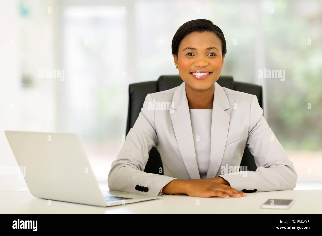 beautiful young afro American businesswoman relaxing in office Stock ... beautiful young afro American businesswoman relaxing in office Stock ...
