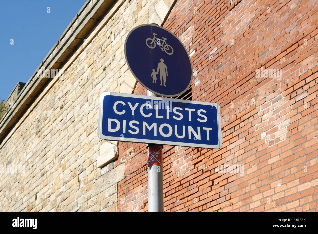 Cyclists Dismount Traffic Sign Stock Photo - Alamy