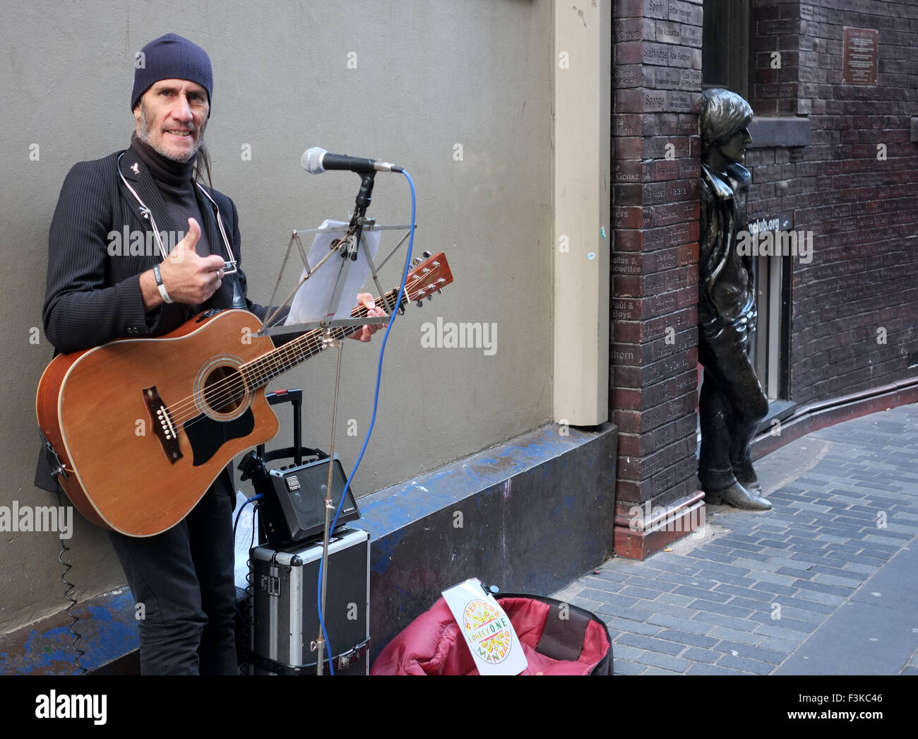 Guitar playing Begging Street Musician Busker in Matthew Street ...