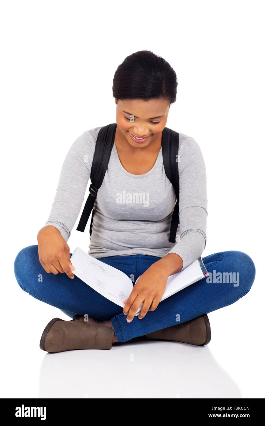 pretty female African college student reading a book isolated on white ...