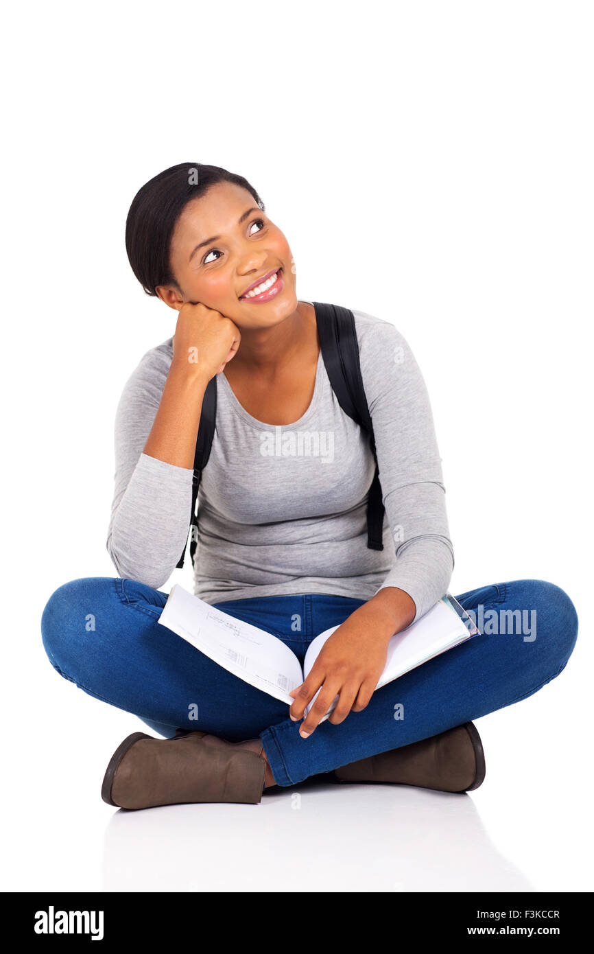 beautiful young female college student looking up on white background ...
