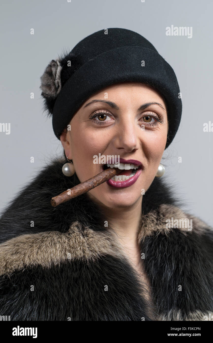 Beautiful girl with cigar hi-res stock photography and images - Alamy