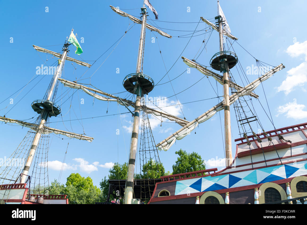 The three masts of a sailboat with furled sails Stock Photo - Alamy