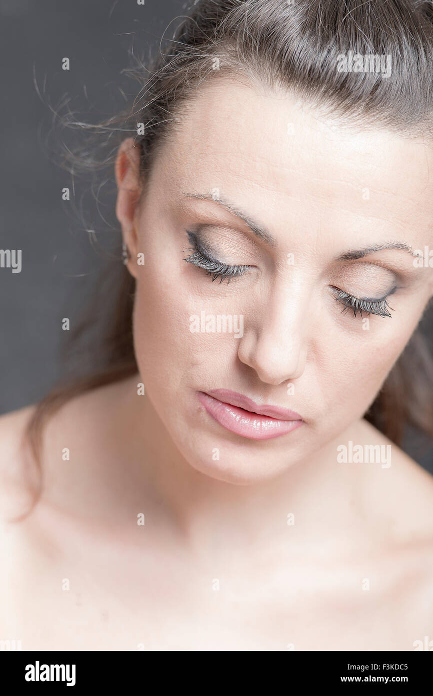 Beautiful young woman with a fresh look, isolated over a white ...