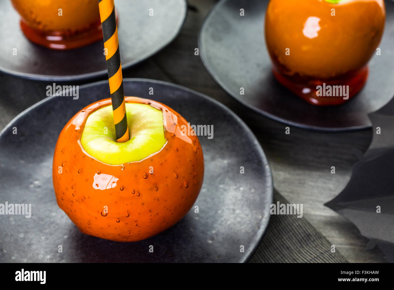 Handmade orange candy apples for Halloween Stock Photo - Alamy