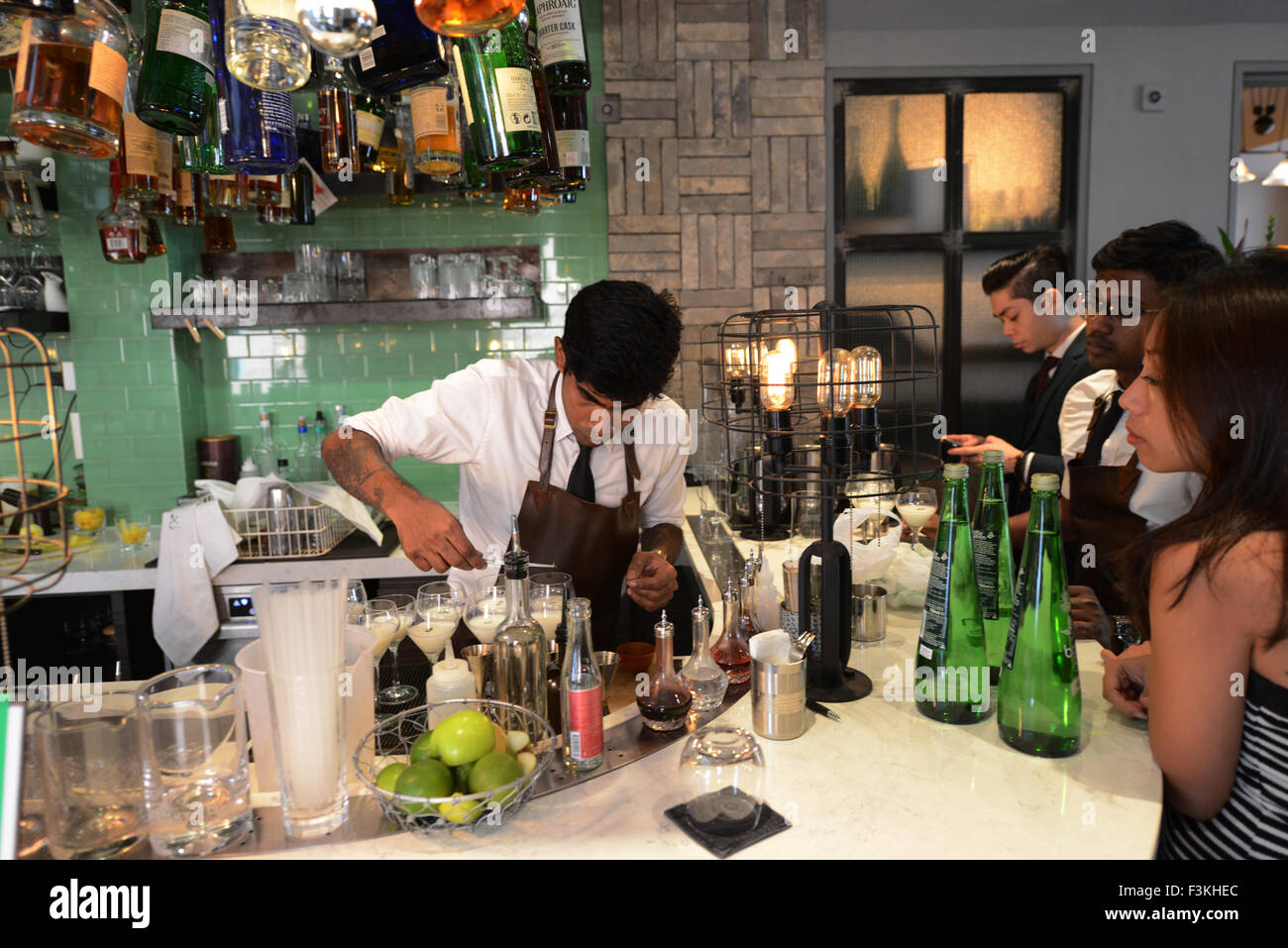Mixing up cocktails at the Tippling Club cocktail bar in Singapore ...