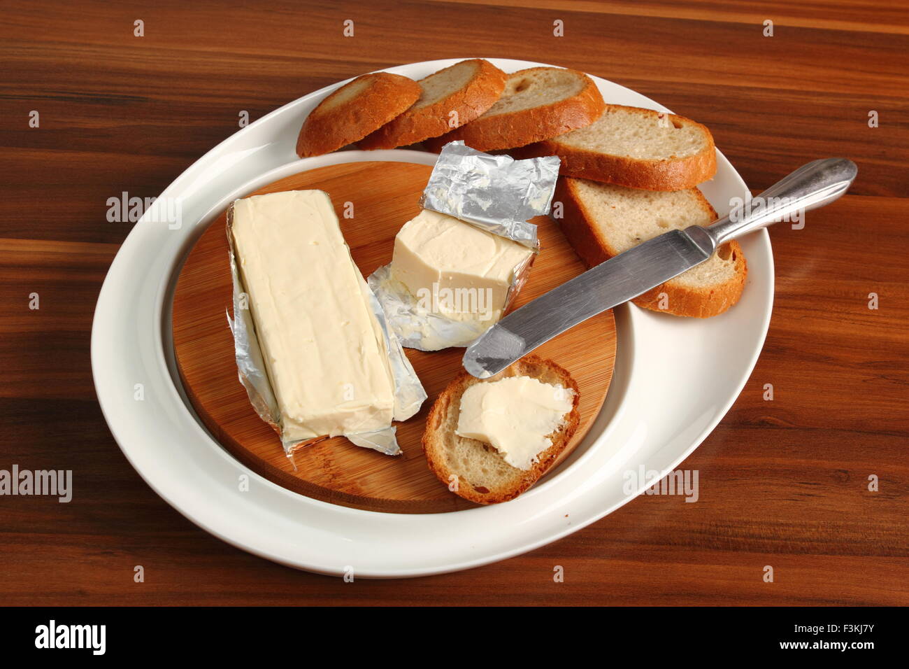 Processed cheese and bread. Breakfast. Appetizer series Stock Photo - Alamy