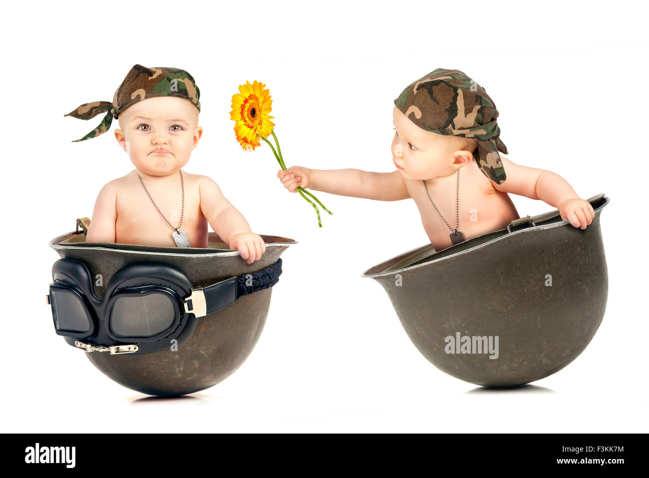 Cute babies inside an old military helmet Stock Photo - Alamy