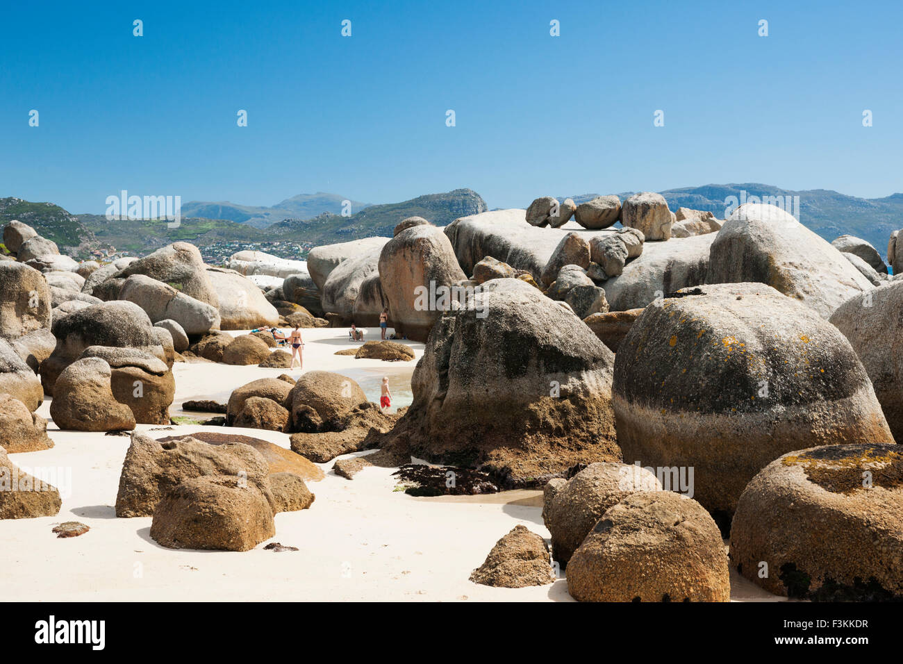Locals enjoying the beach with giant boulders and rock formations at ...
