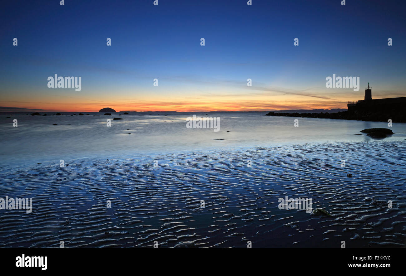 Girvan Harbour at Sunset with the isle of Ailsa Craig in the background ...