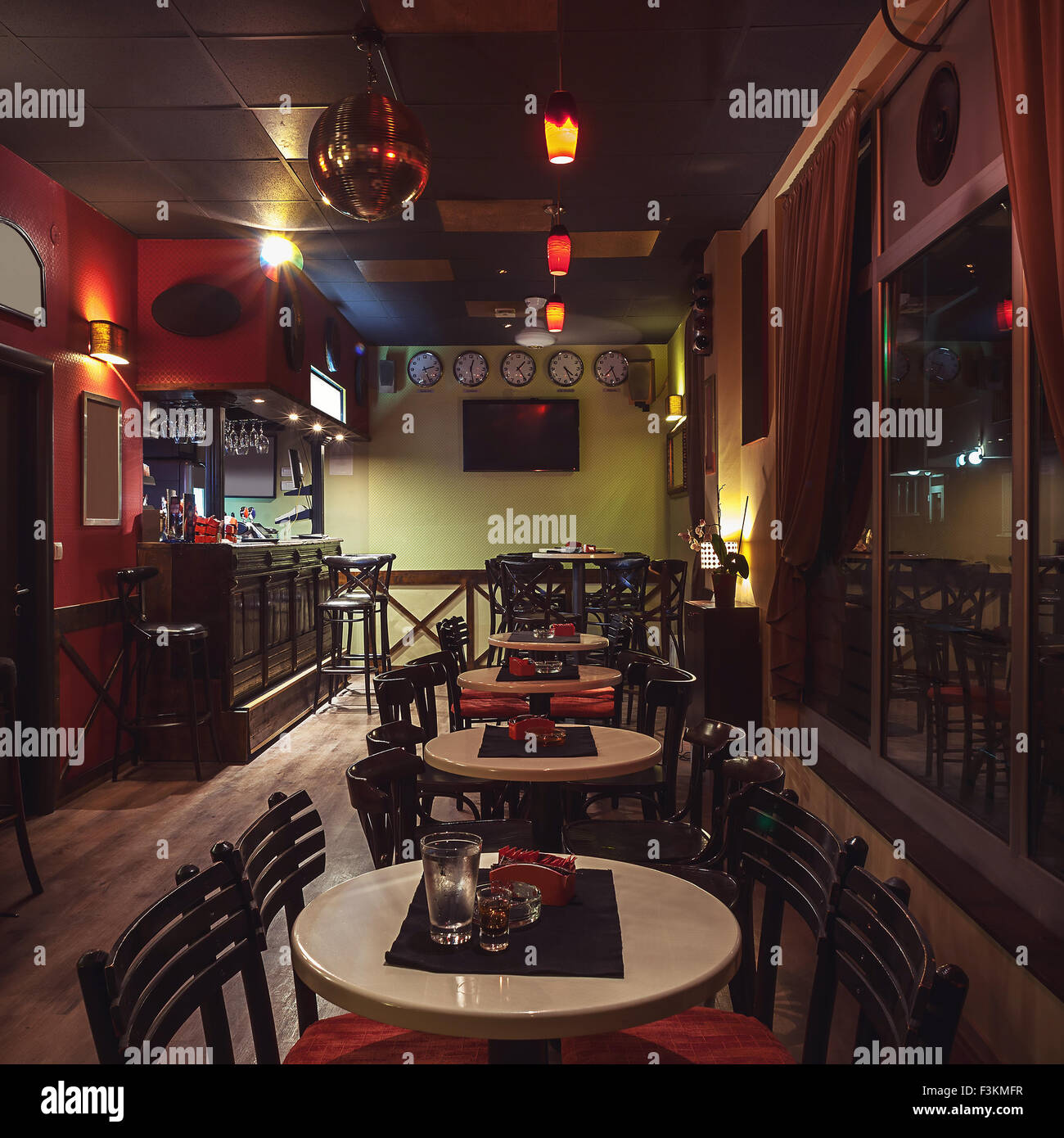 Interior of a modern cafe in retro style, night scene. Illumination ...