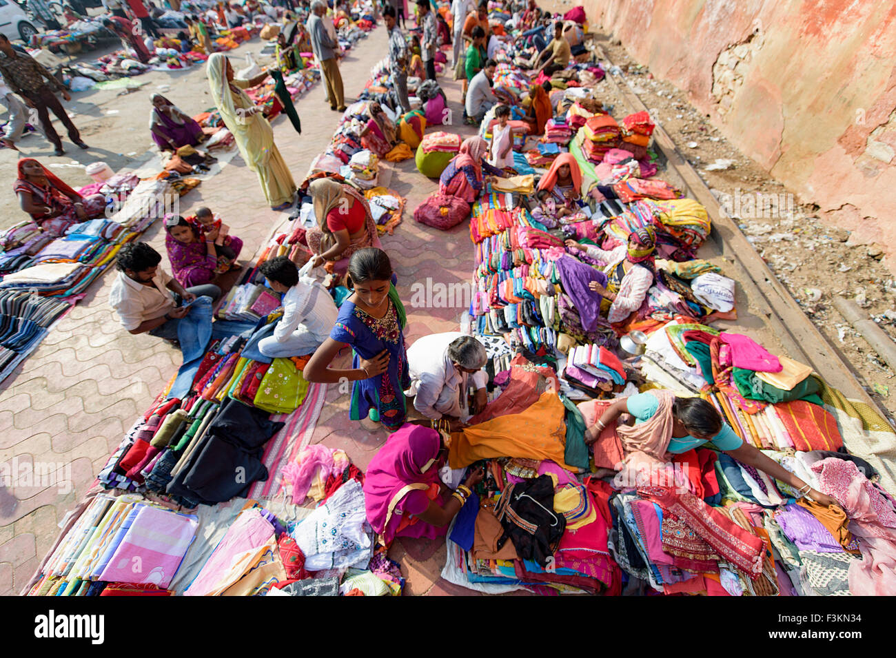Colourful clothes and saree selling by street vendor during sunday ...