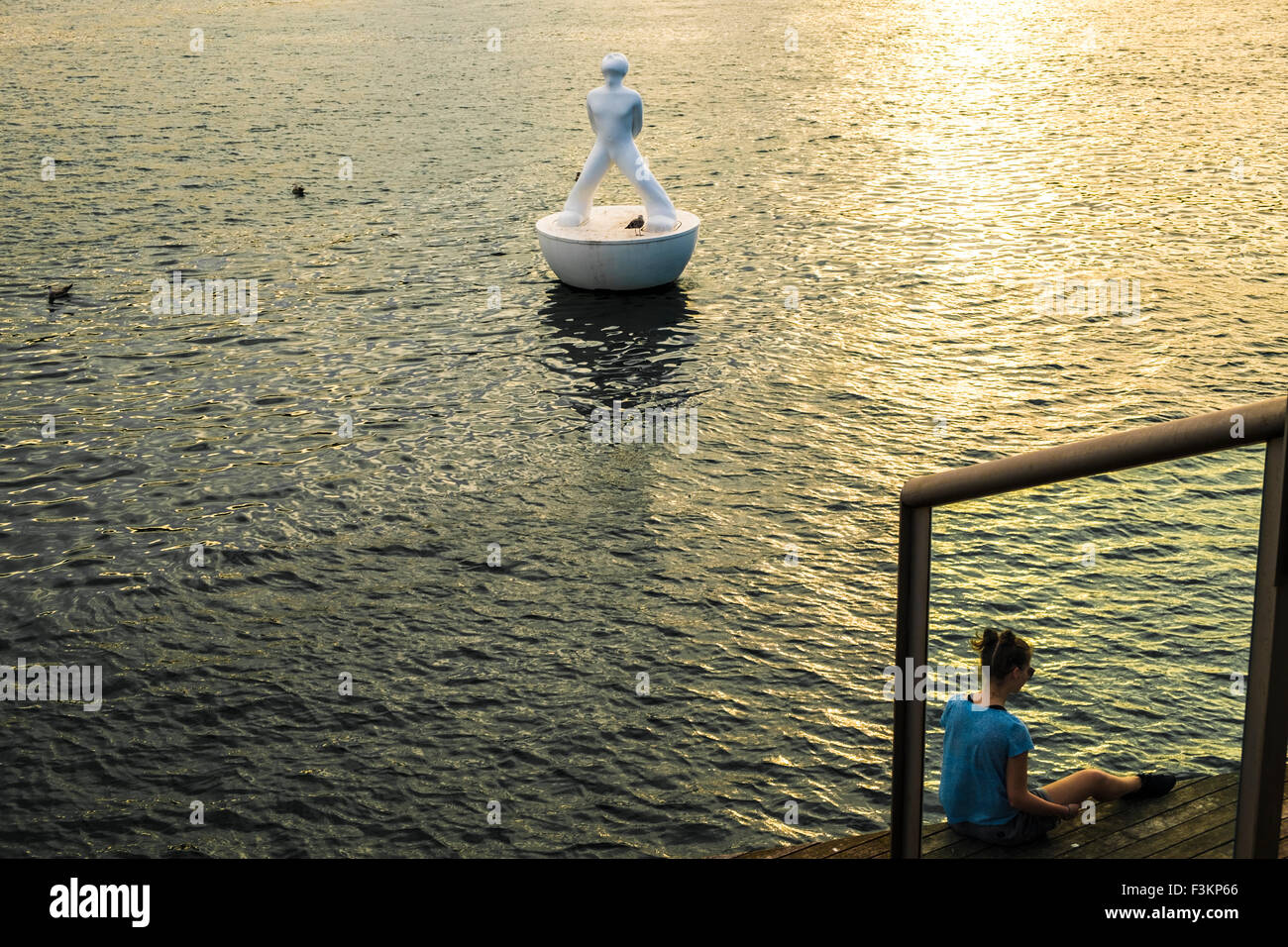 floating statue stargazer by sculptor Robert Llimosin Port Vell in ...