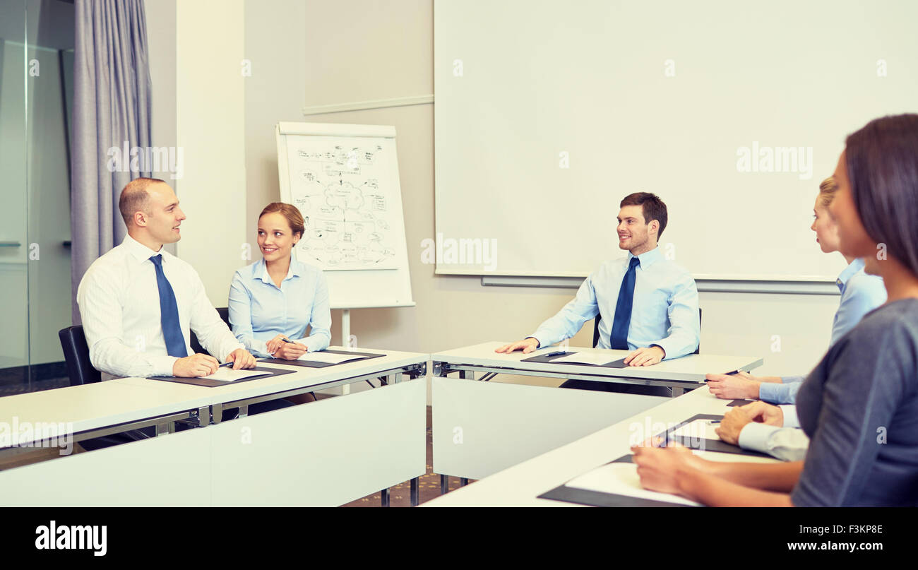 group of smiling businesspeople meeting in office Stock Photo - Alamy