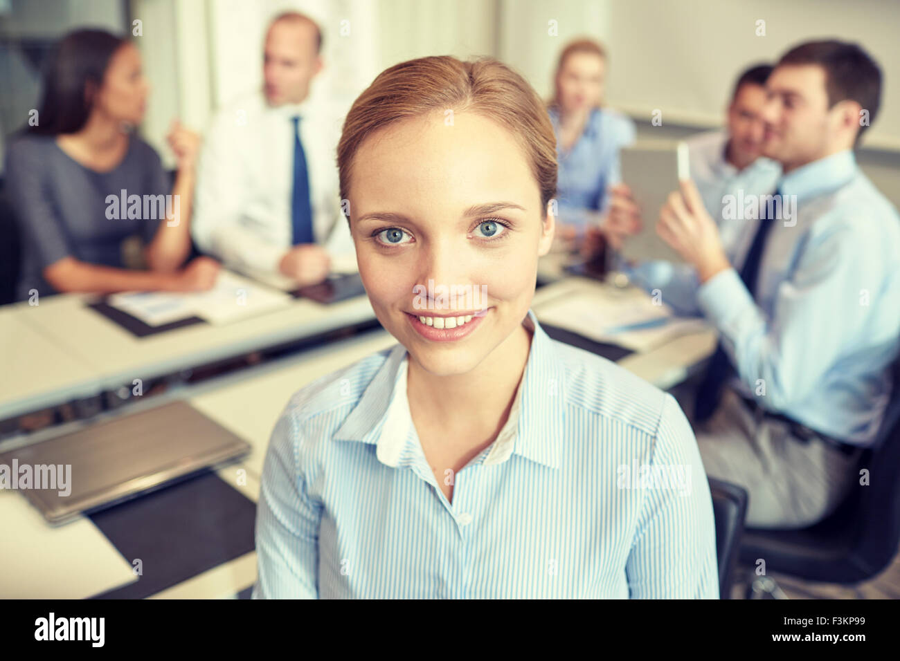 group of smiling businesspeople meeting in office Stock Photo - Alamy