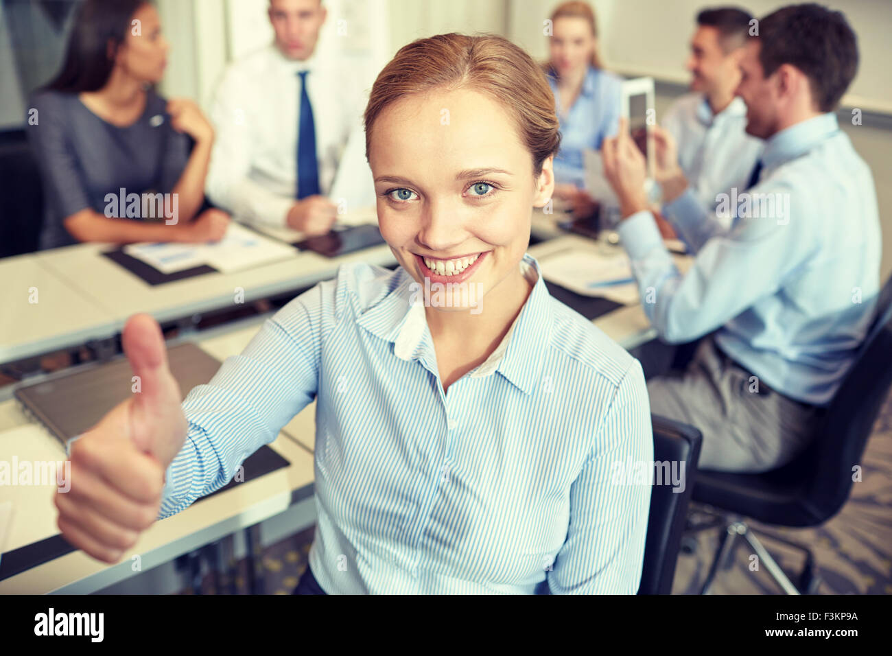 group of smiling businesspeople meeting in office Stock Photo - Alamy