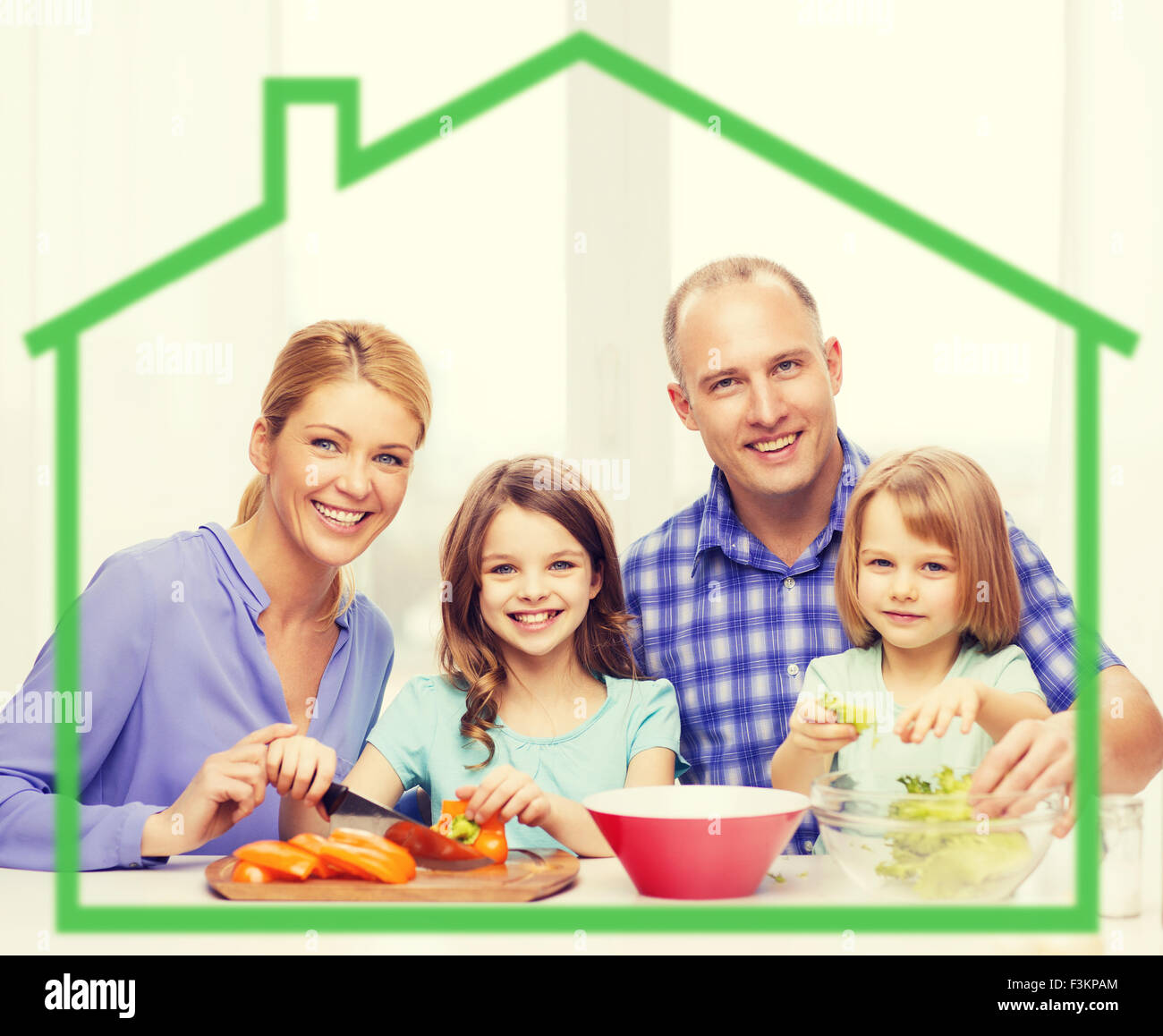 happy family with two kids making dinner at home Stock Photo - Alamy