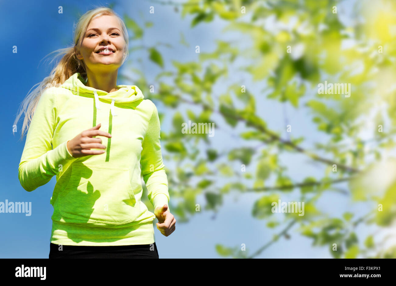 woman jogging outdoors Stock Photo - Alamy