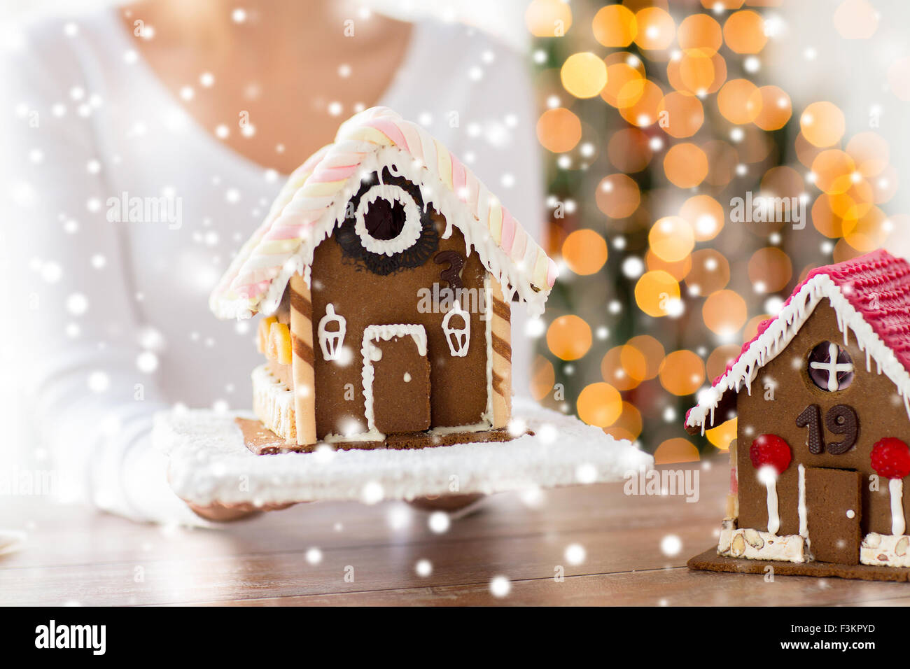 close up of woman showing gingerbread house Stock Photo - Alamy