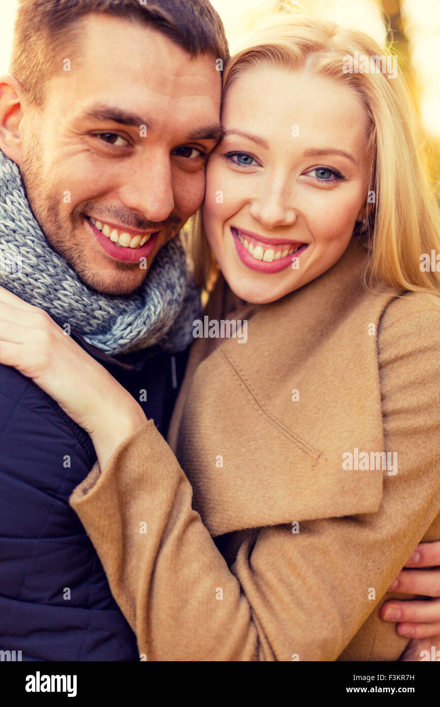 smiling couple hugging in autumn park Stock Photo - Alamy