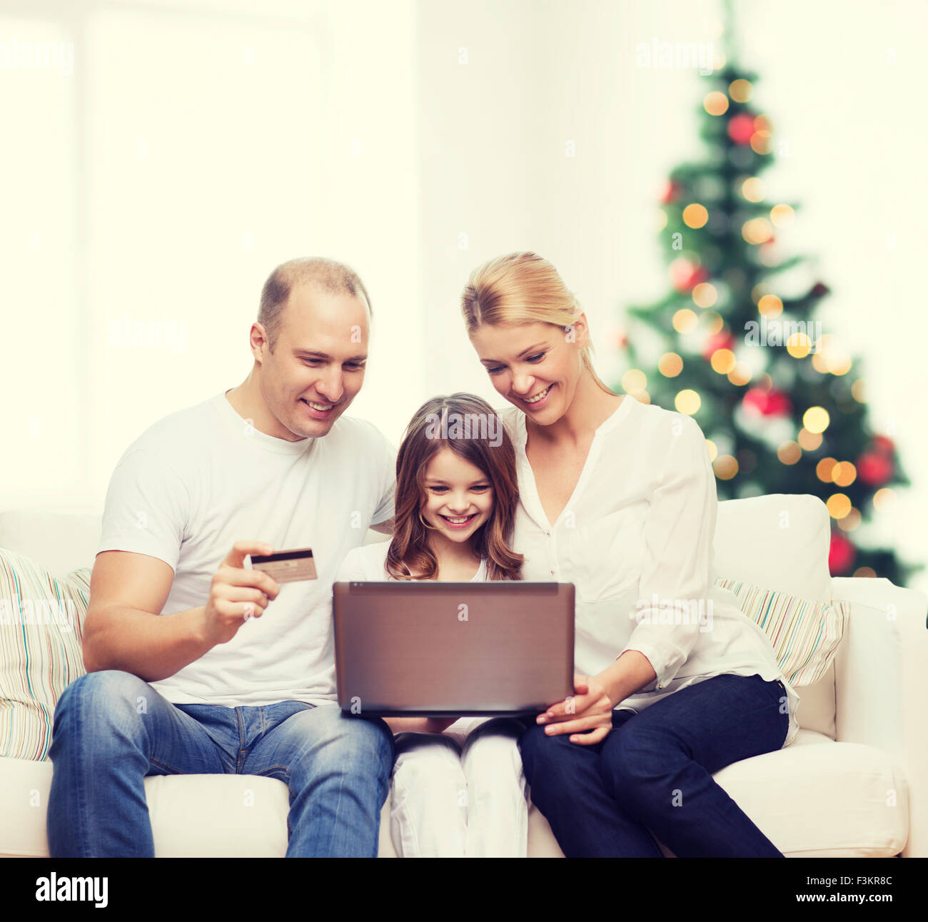 happy family with laptop computer Stock Photo - Alamy