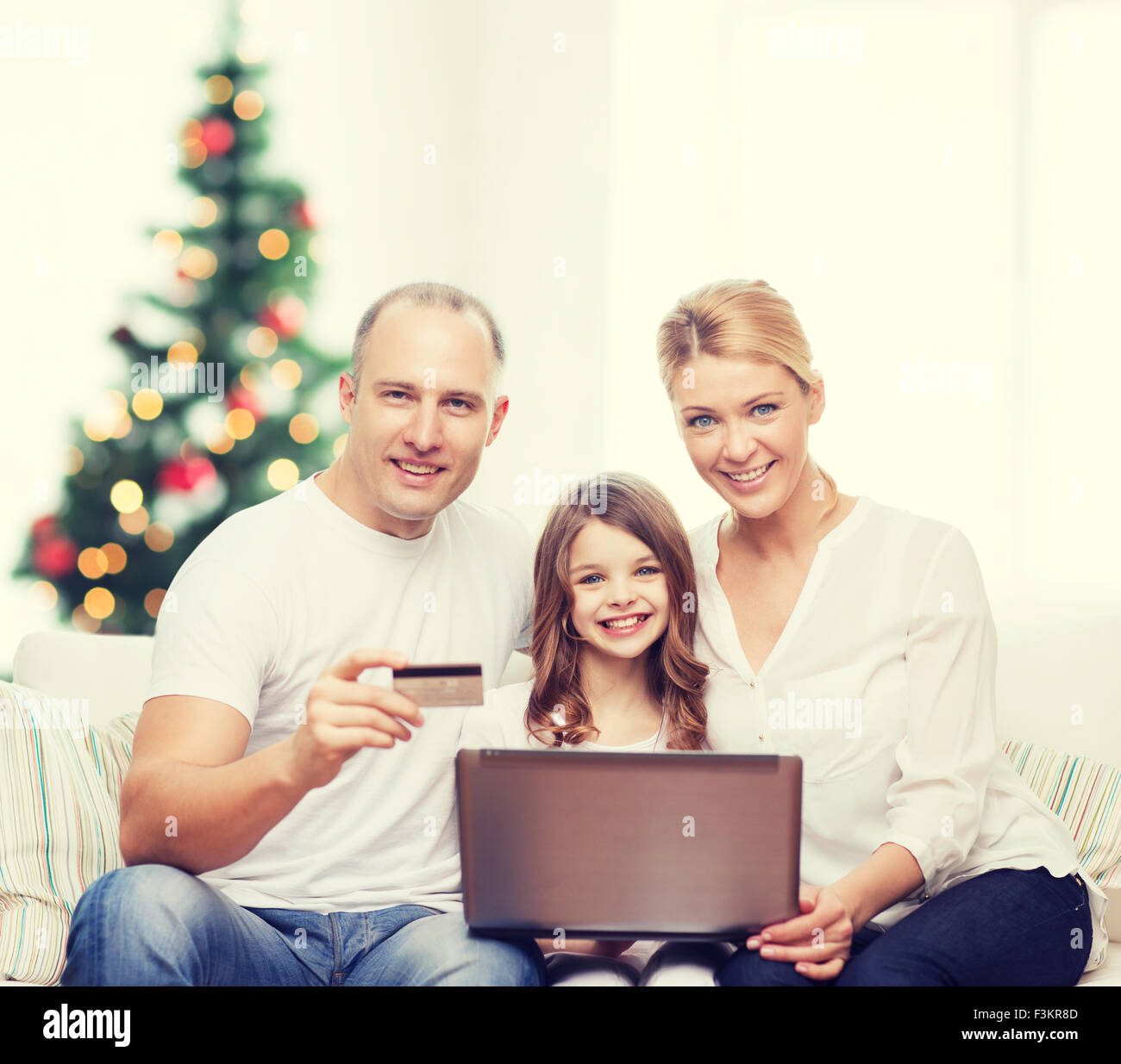 happy family with laptop computer Stock Photo - Alamy