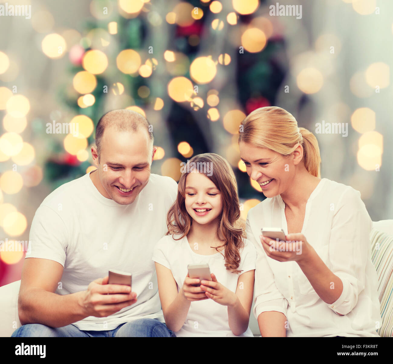 happy family with smartphones Stock Photo - Alamy