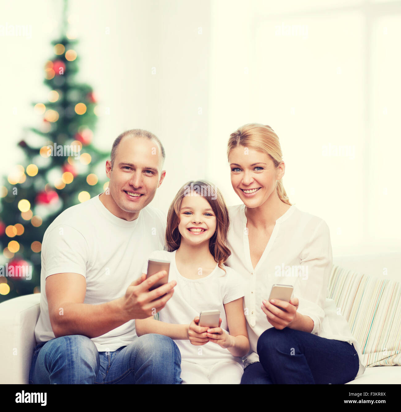 happy family with smartphones Stock Photo - Alamy