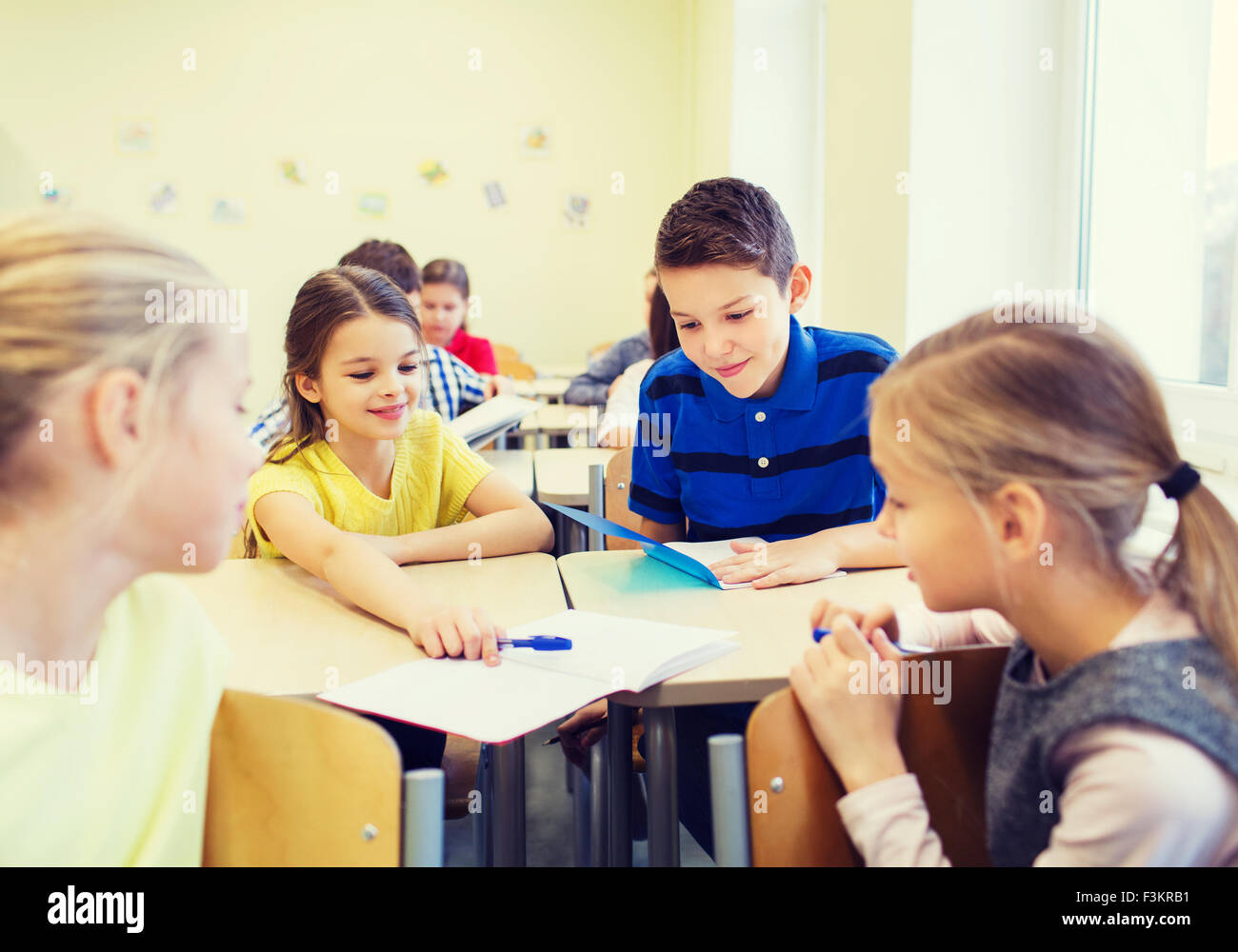 group of school kids writing test in classroom Stock Photo - Alamy