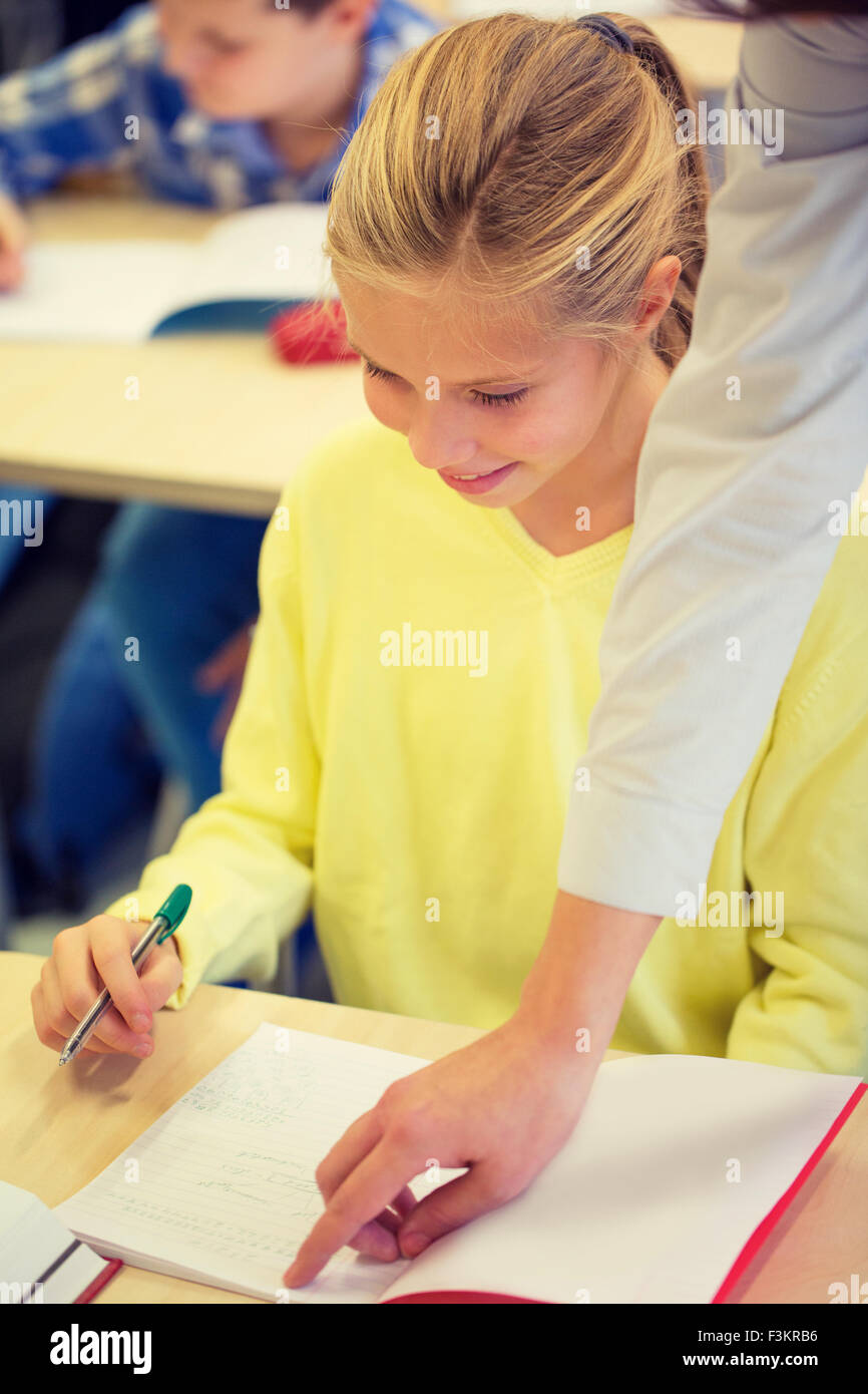 group of school kids writing test in classroom Stock Photo - Alamy