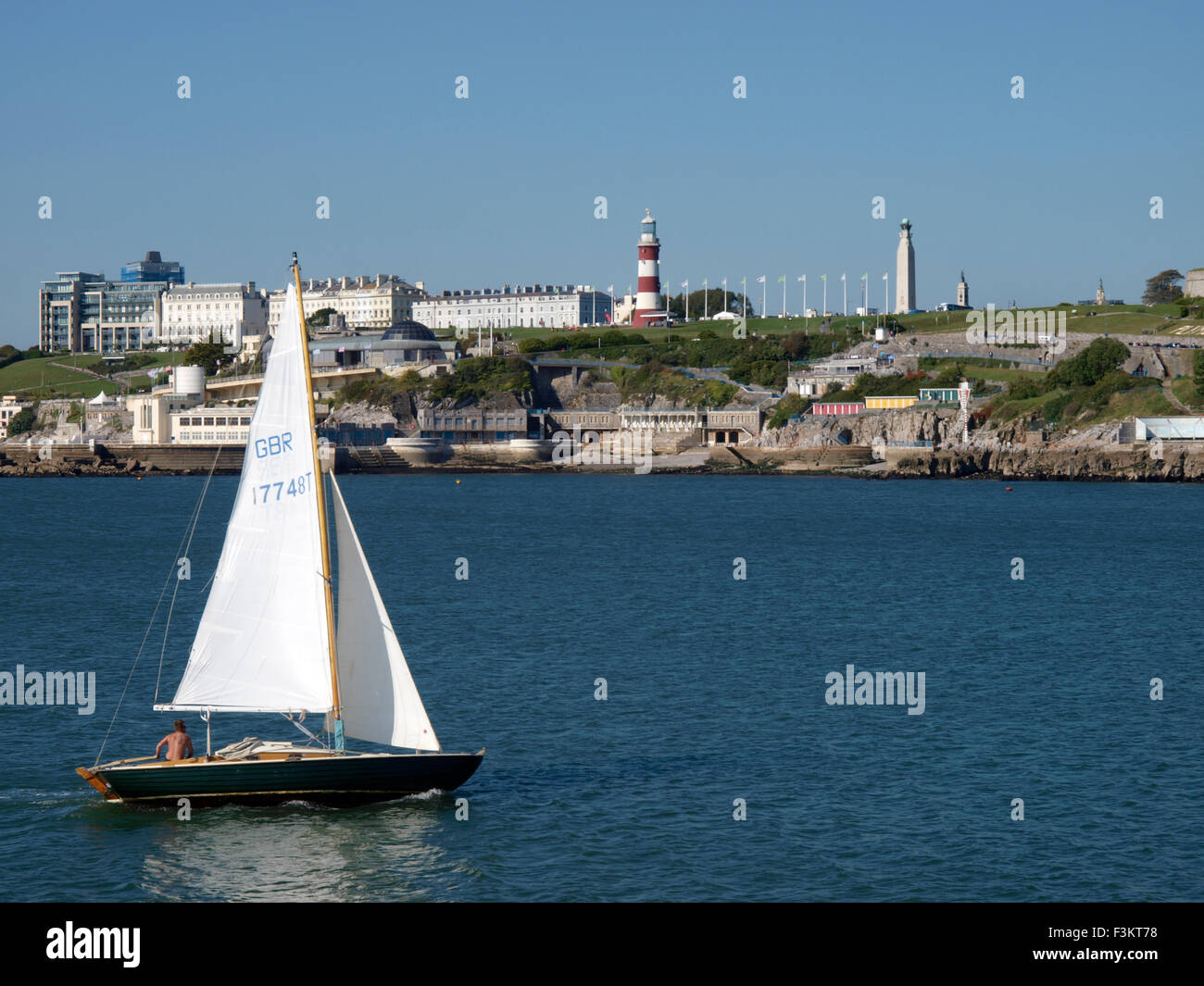 Small yacht sailing up the Plymouth Sound, Devon, UK Stock Photo - Alamy