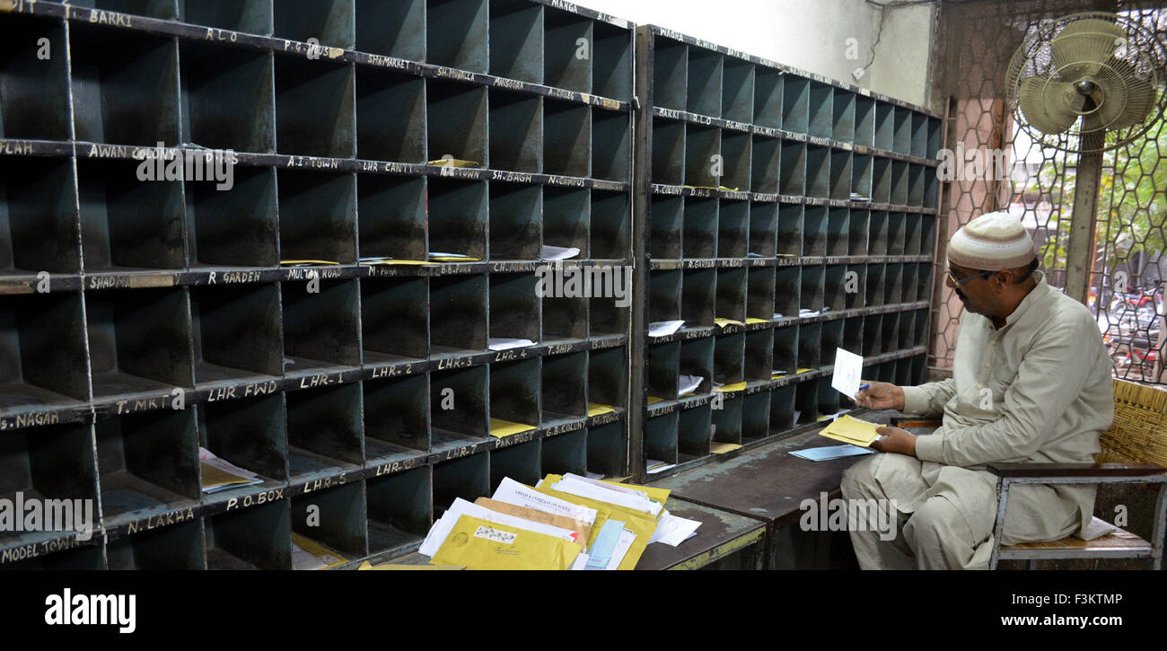 Lahore. 9th Oct, 2015. A Pakistani postman arranges mails at a post ...