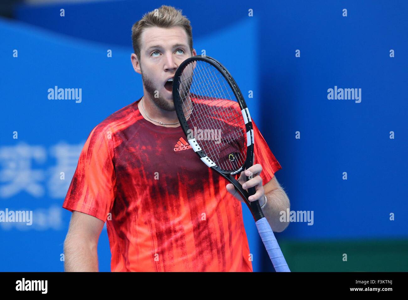 Beijing, China. 9th Oct, 2015. Jack Sock of the United States bites the ...