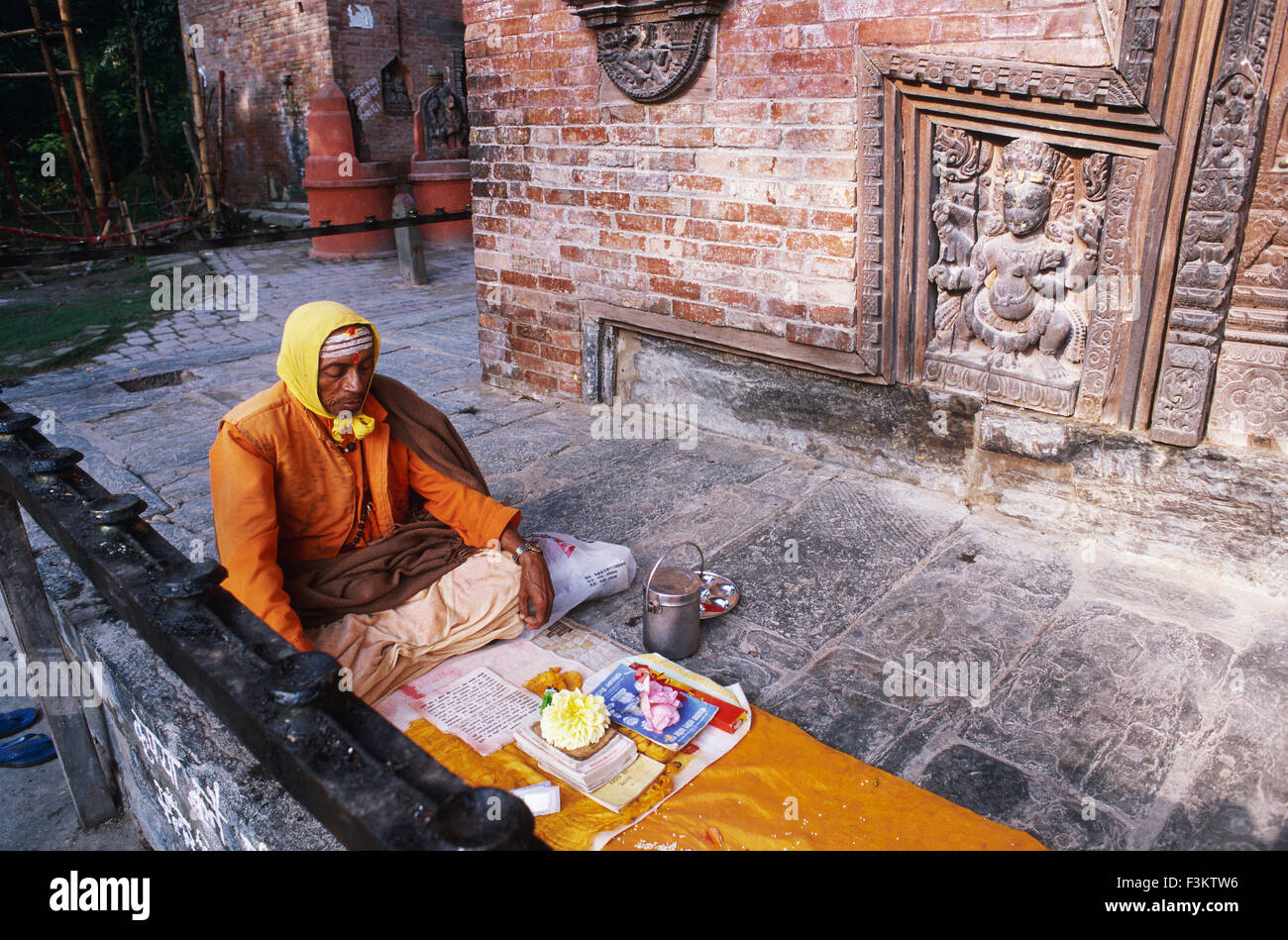 Hindu priest reading holy scriptures in front of a temple ( Nepal Stock ...